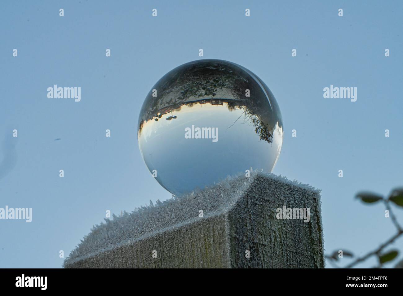 A crisp winters morning view through a clear crystal ball, an upside ...