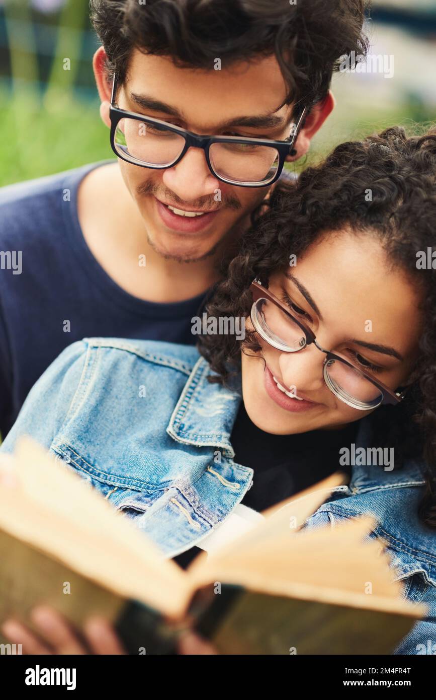 Shes gotten me into reading. a teenage couple reading a book together ...