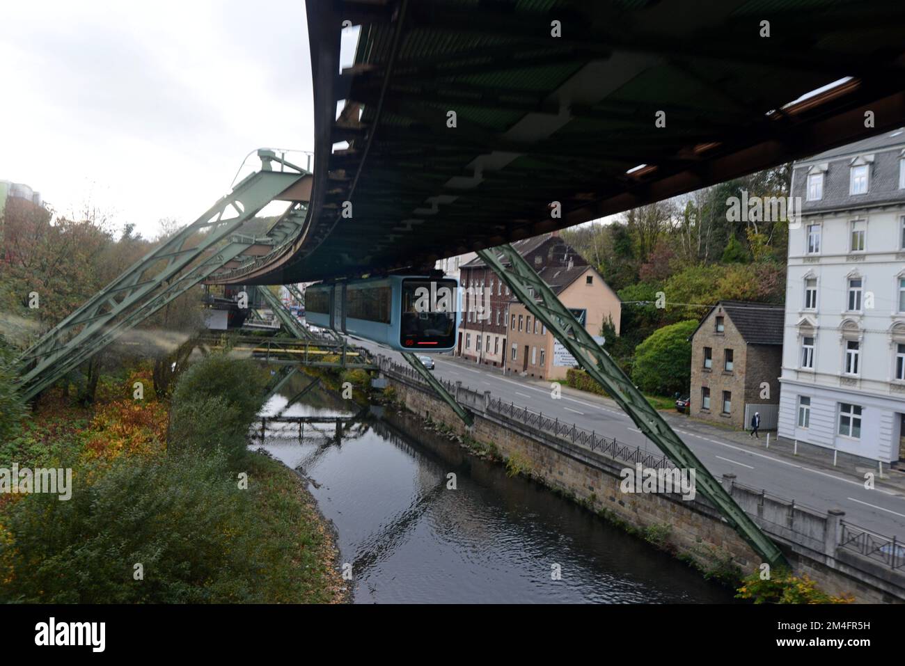 The unusual hanging monorail train knwn as the Schwebebahn, in ...