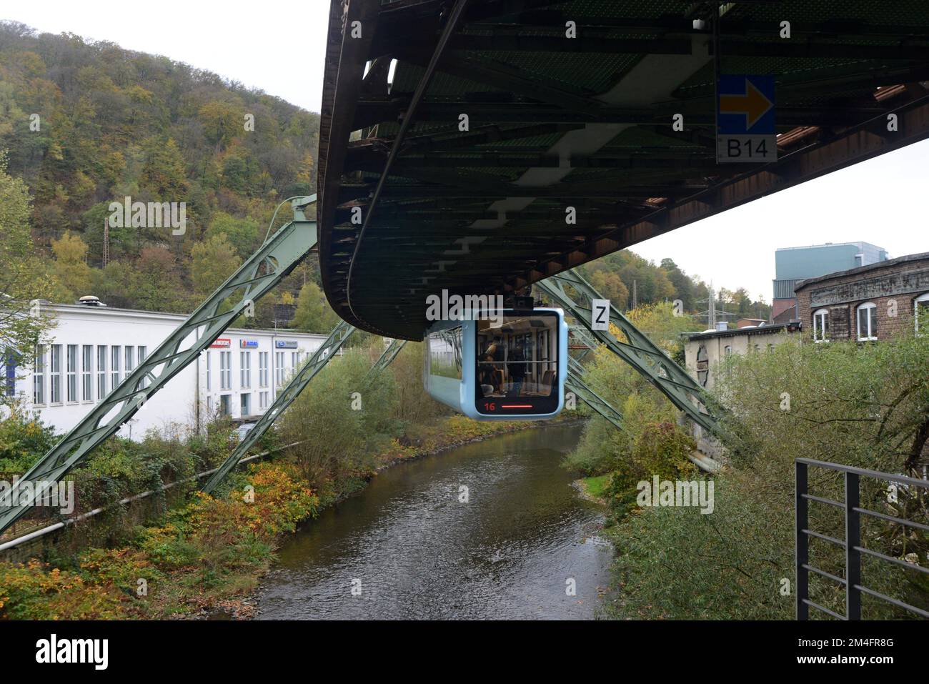 The unusual hanging monorail train knwn as the Schwebebahn, in ...