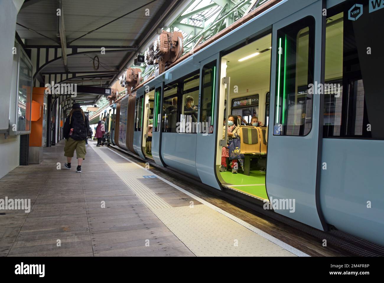 The unusual hanging monorail train knwn as the Schwebebahn, in ...