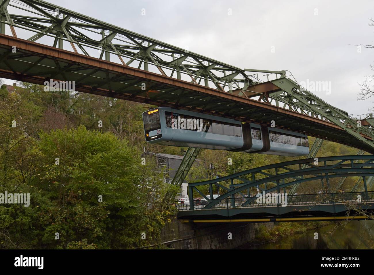 The unusual hanging monorail train knwn as the Schwebebahn, in ...