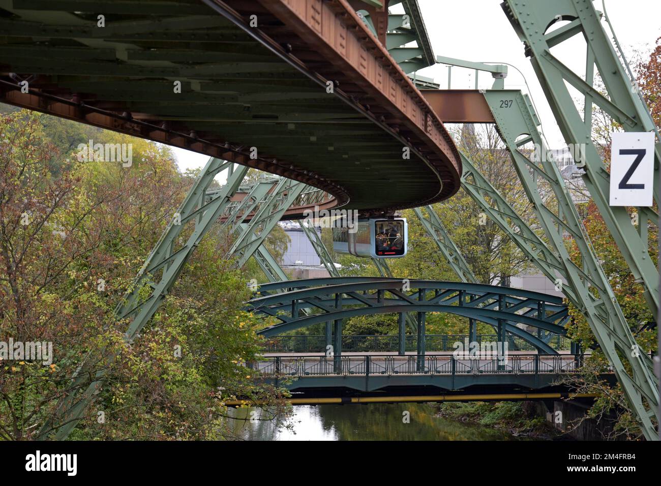The unusual hanging monorail train knwn as the Schwebebahn, in ...