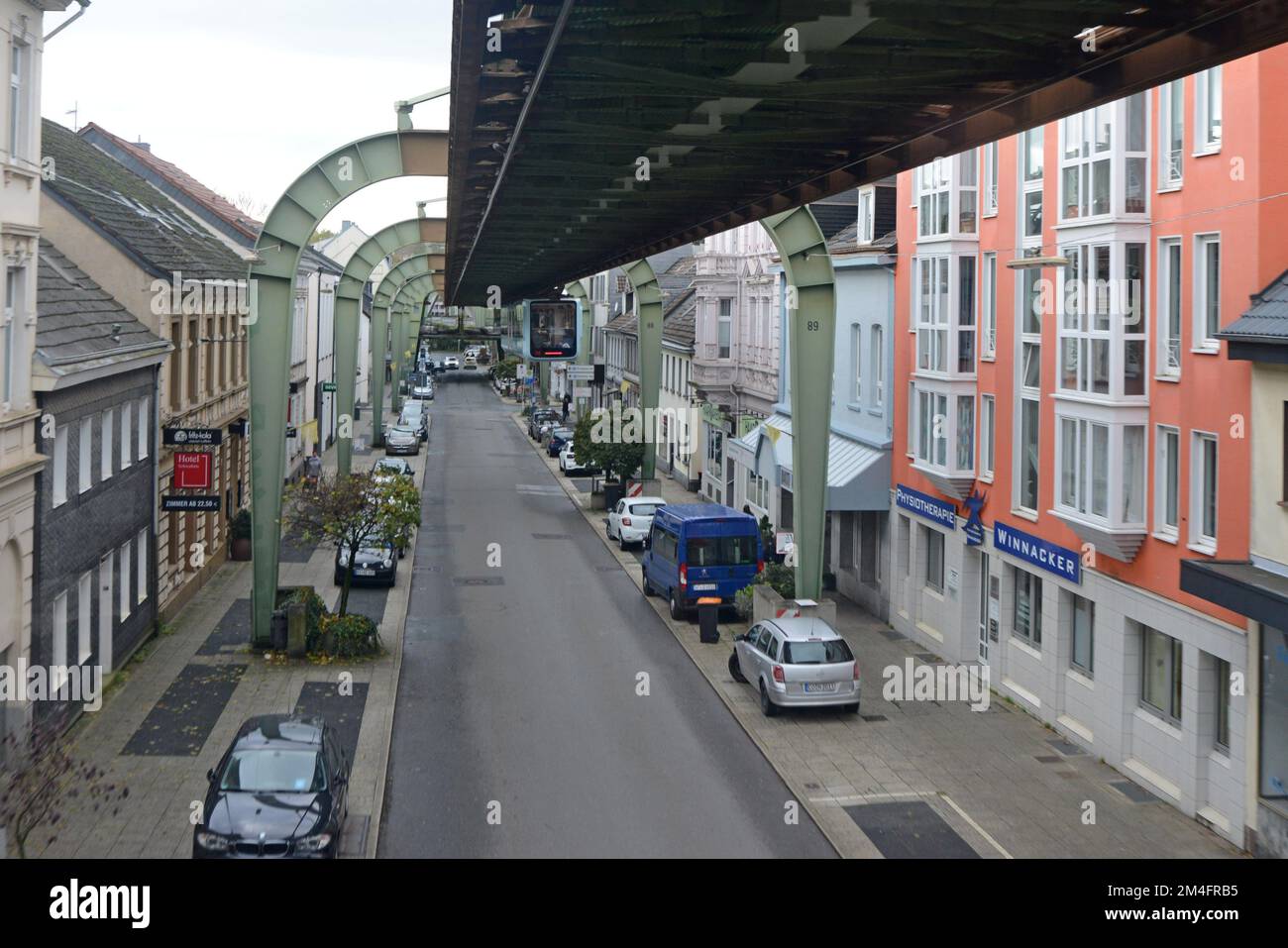 The unusual hanging monorail train knwn as the Schwebebahn, in ...