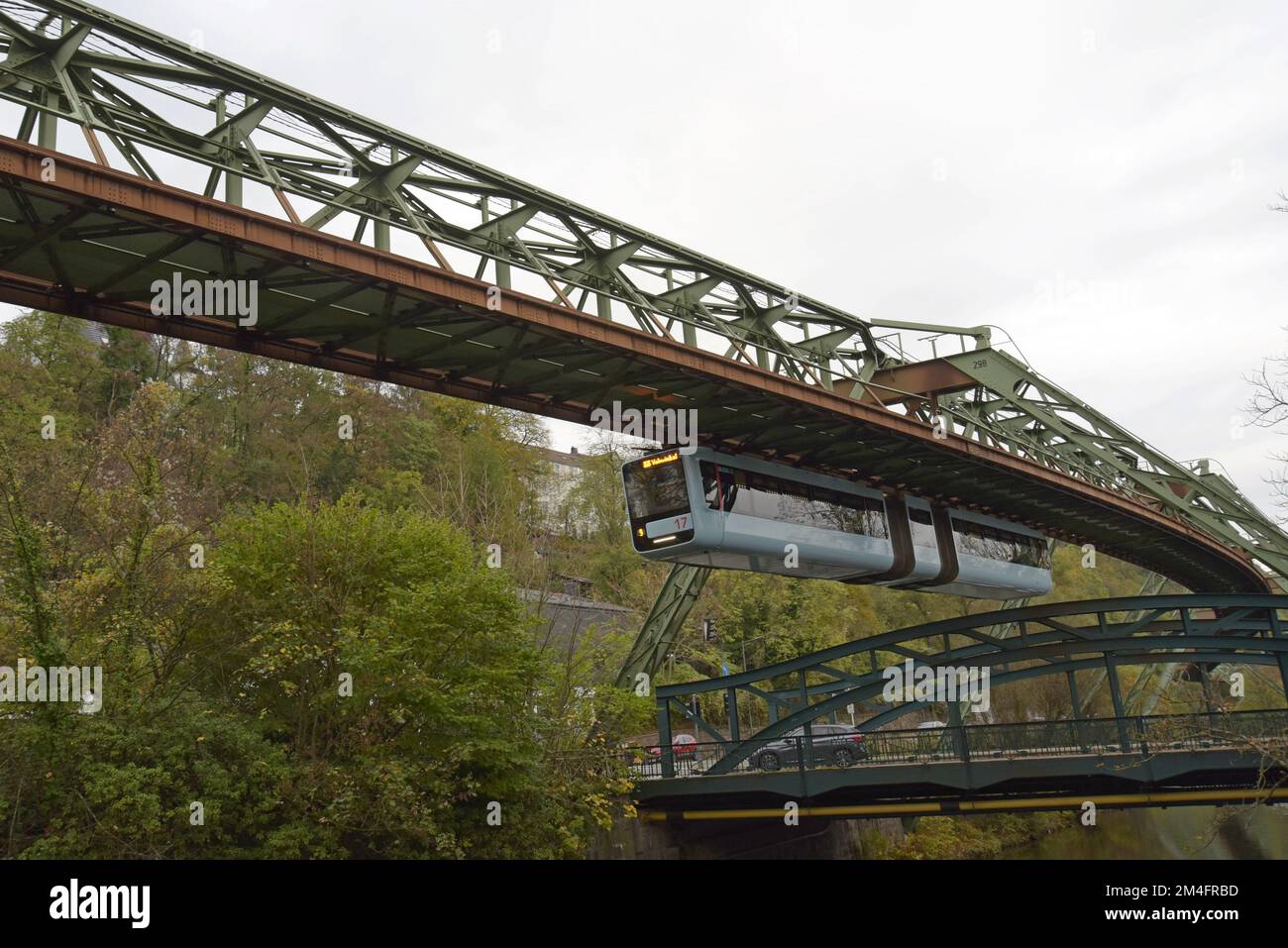 The unusual hanging monorail train knwn as the Schwebebahn, in ...