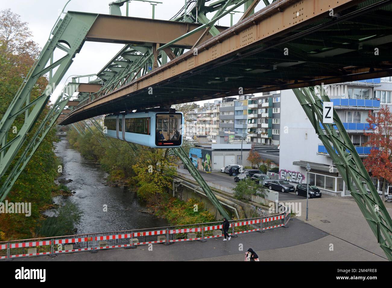 The unusual hanging monorail train knwn as the Schwebebahn, in ...