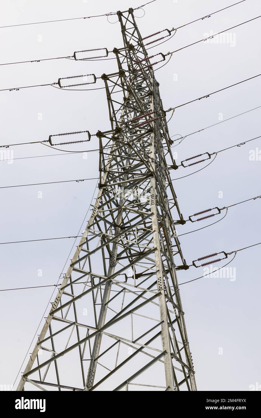 Modern large high voltage electric tower closeup Stock Photo - Alamy
