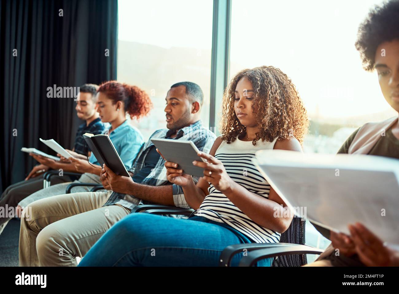 Paying attention to every little detail. a group of young focussed work ...