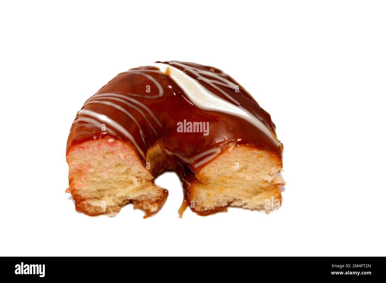 A ring donut topped with caramel and white chocolate sauce, A glazed ...