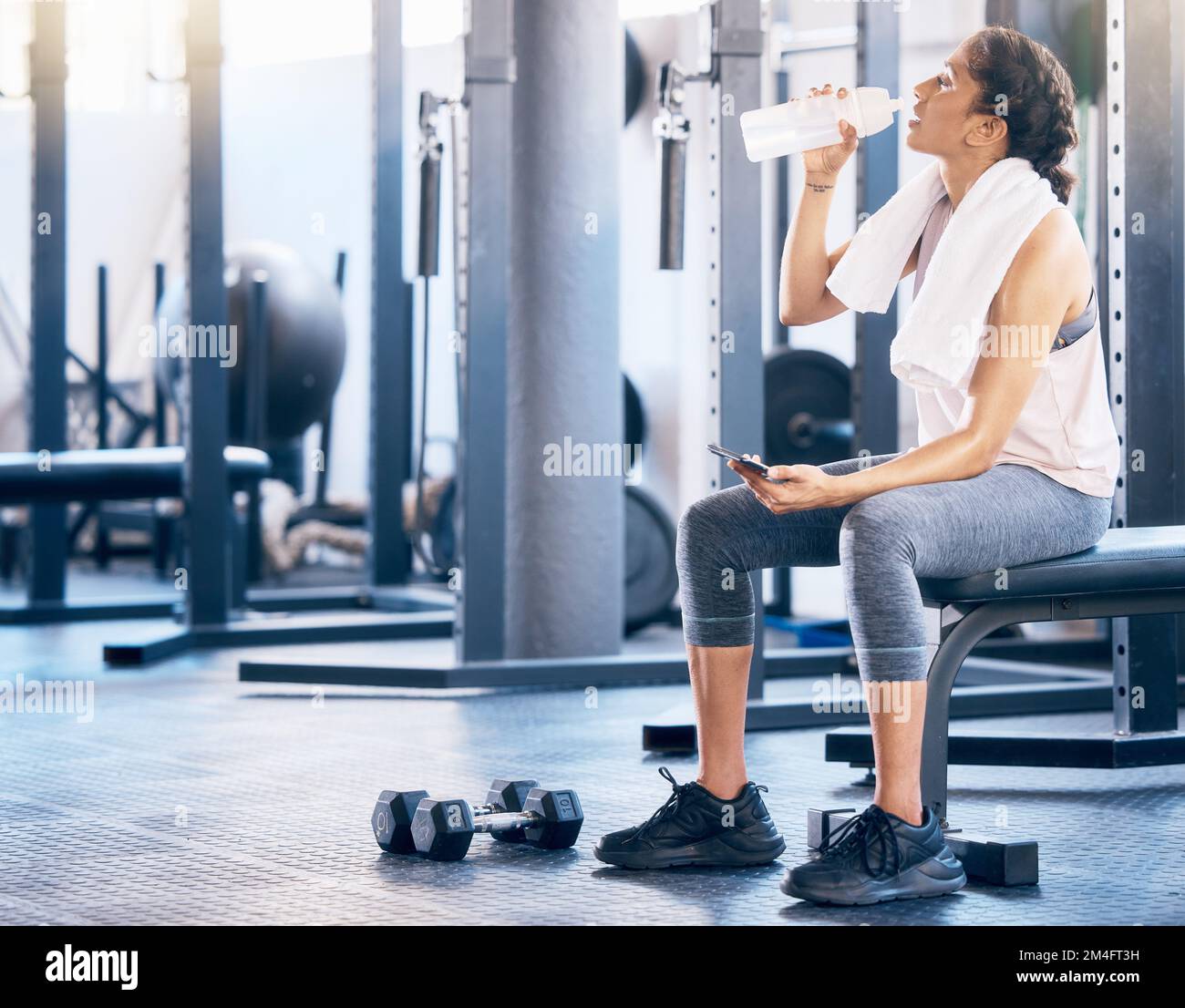 Fitness, gym and woman drinking water after workout for hydration ...
