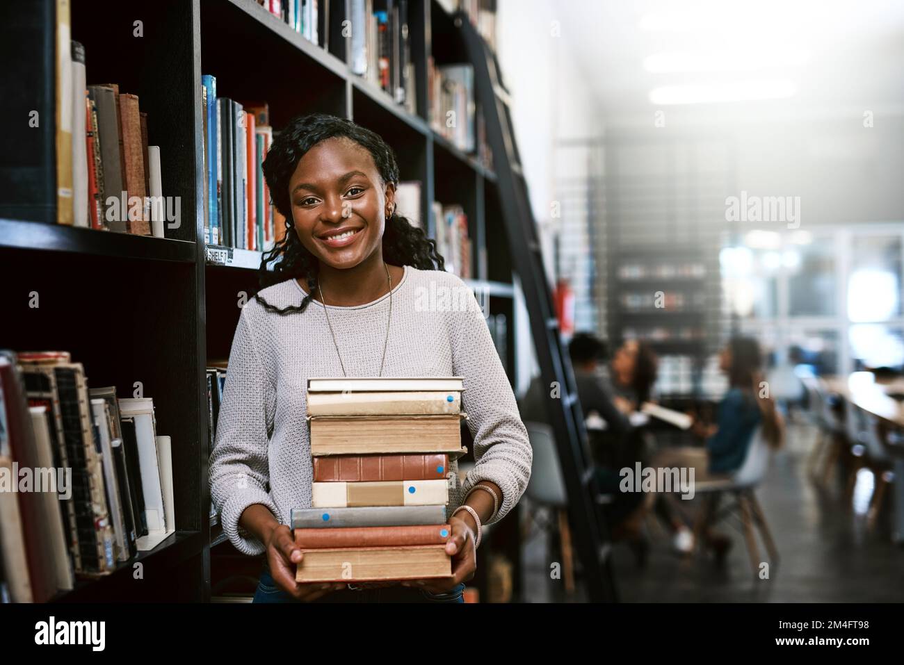 Student Carrying Too Many Books