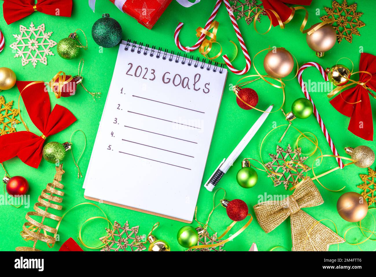 Notebook with New's Year Resolutions massage, with Christmas ornaments ...