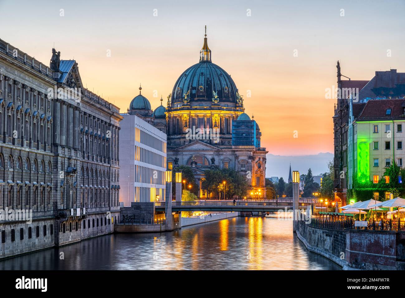 The river Spree in Berlin after sunset with the cathedral in the back ...