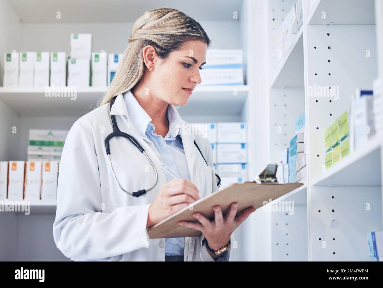Inventory checklist, pharmacist and woman in pharmacy recording ...