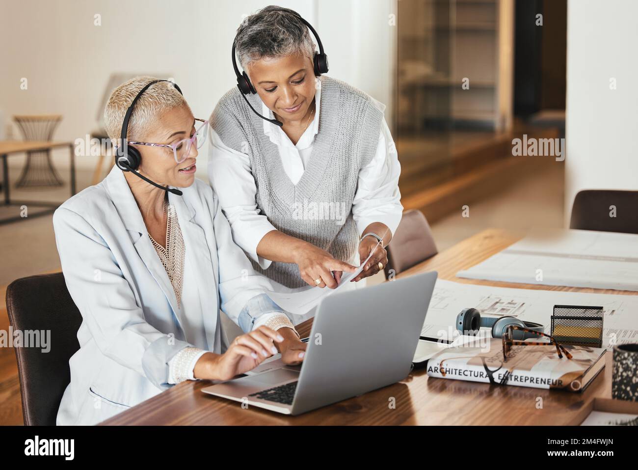 Laptop, consulting and woman help mentor while doing presentation in a ...