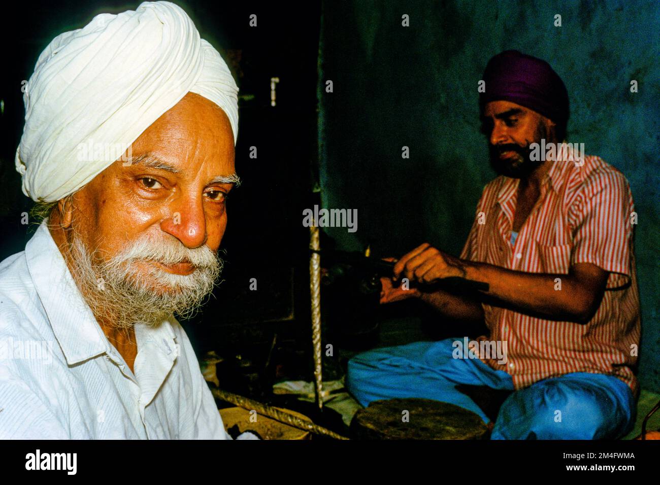 Silversmith working for the Golden Temple Society Stock Photo - Alamy