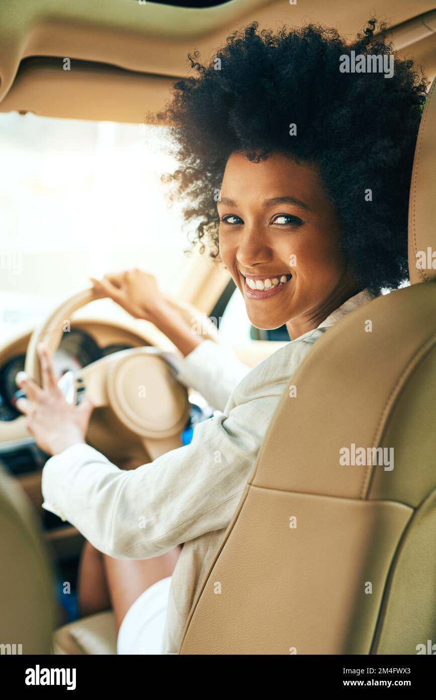 Getting to the destination in style. Portrait of a cheerful young ...