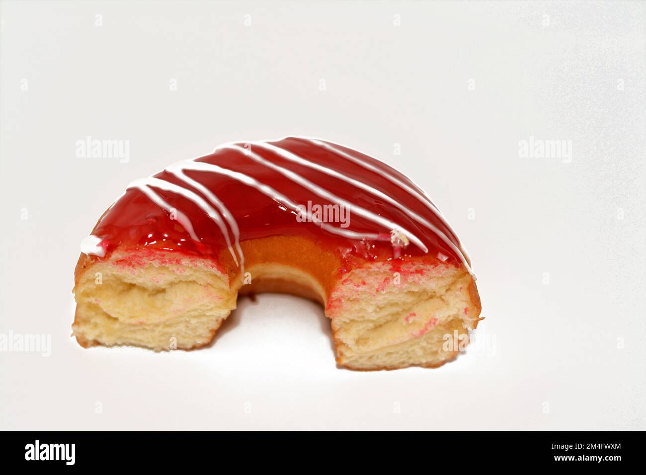 Strawberry flavor ring donut with white chocolate sauce, glazed, yeast ...