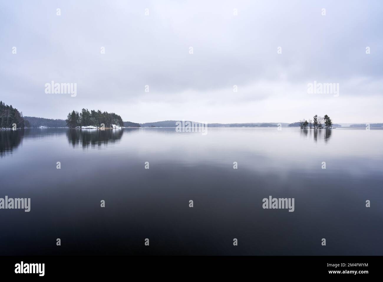 reflections in the lake and water in gray winter day Stock Photo - Alamy