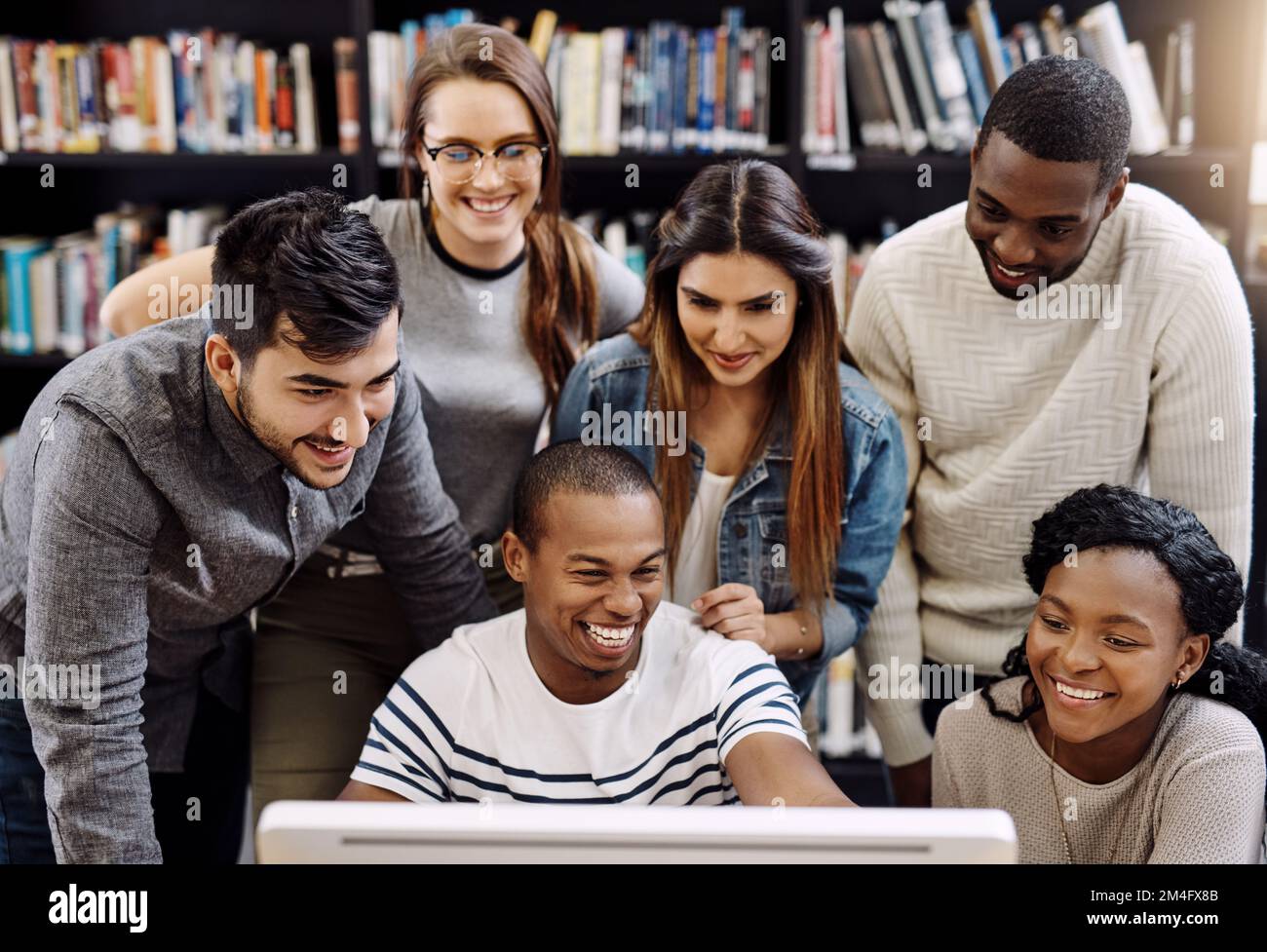 Who said studying was a bore. a group of young students using a ...