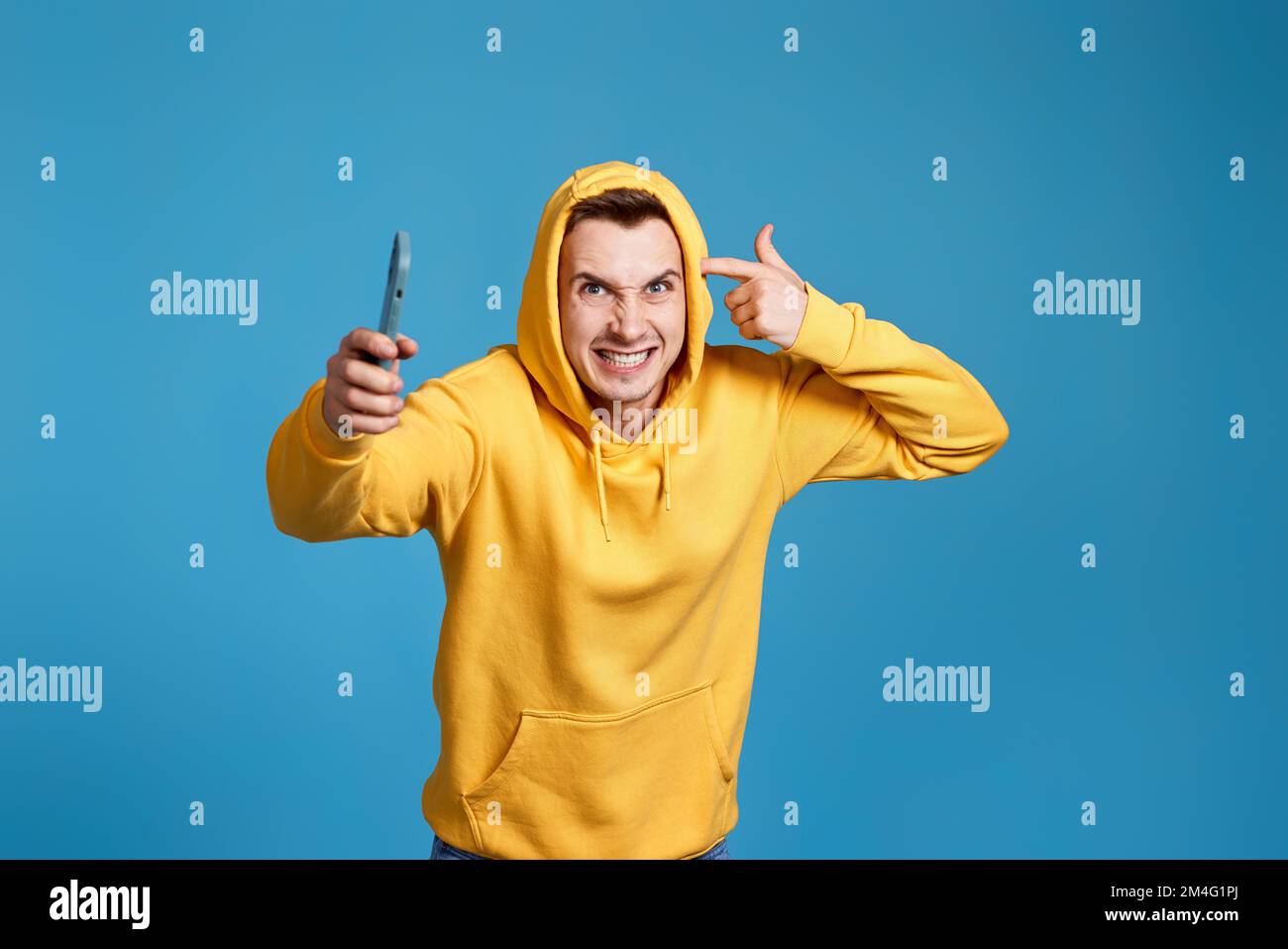 Angry man in yellow hi-res stock photography and images - Alamy