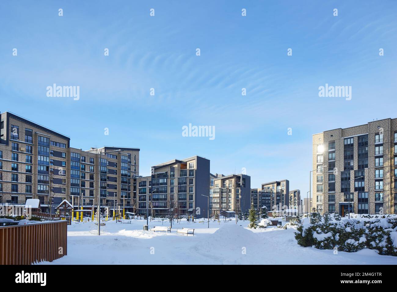 New modern block of flats in green area at winter. residential ...