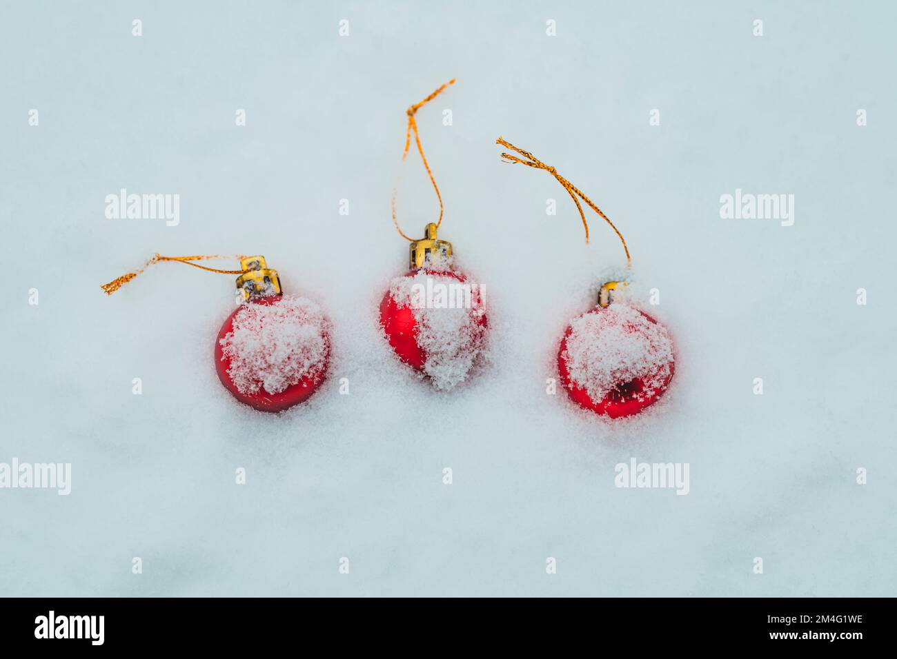 Christmas baubles covered with snow, three red baubles Stock Photo - Alamy Christmas baubles covered with snow, three red baubles Stock Photo - Alamy