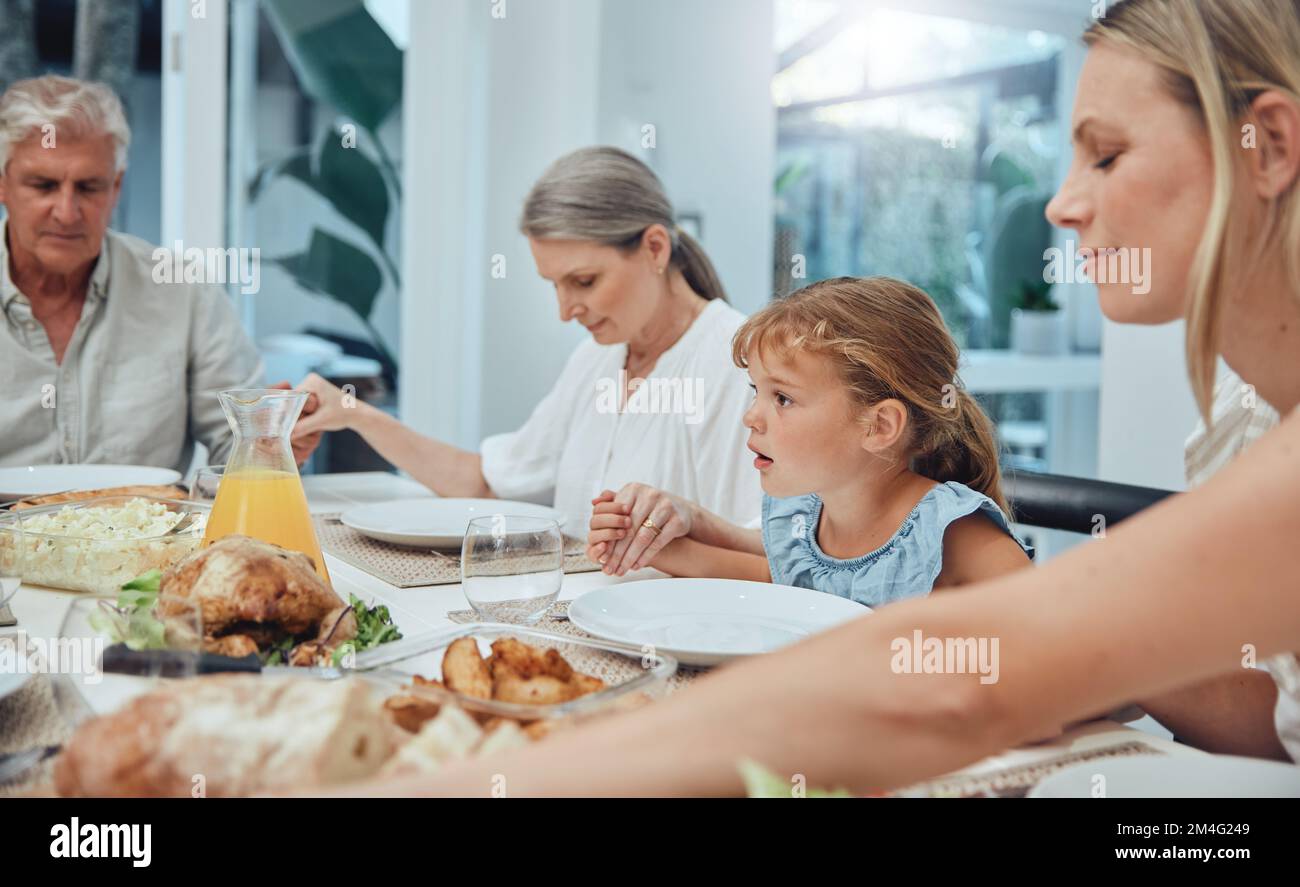 Family, holding hands or praying to God for food with mother ...