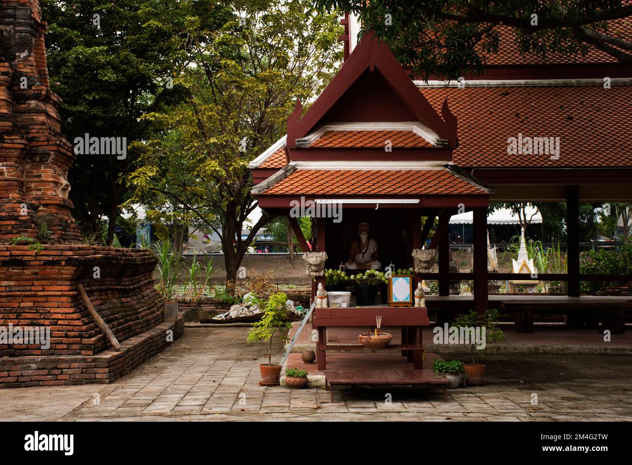 Ancient hermit or antique ruin eremite statues in shrine for thai ...