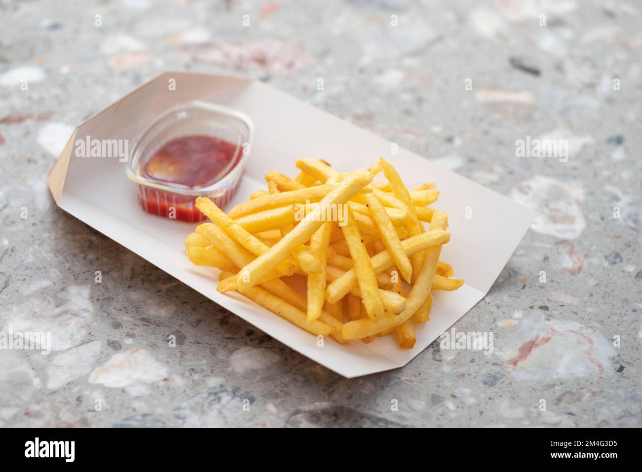 cardboard box of French fries in a takeaway dish of a snac Stock Photo ...