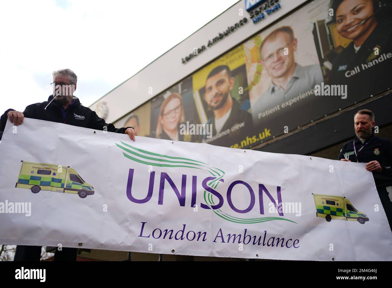 Members of staff places a banner on the railings outside Waterloo ...