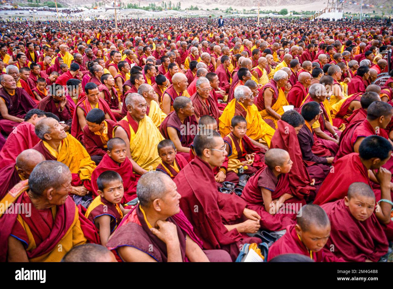 Thousands of buddhist monks listening to the teachings of the Dalai ...