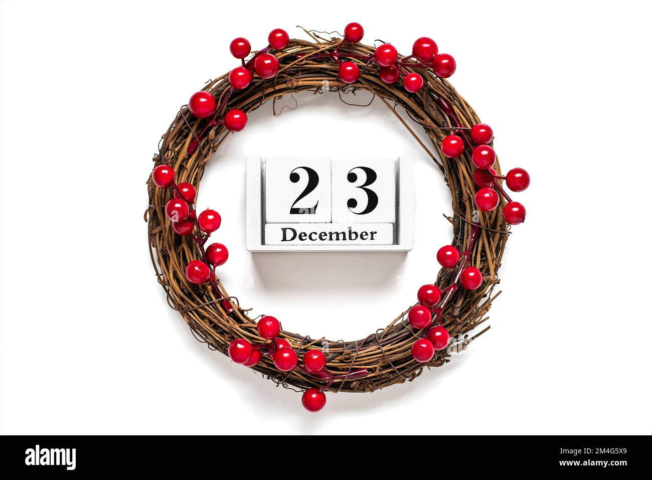 Christmas wreath decorated with red berries, wooden calendar date 25 ...