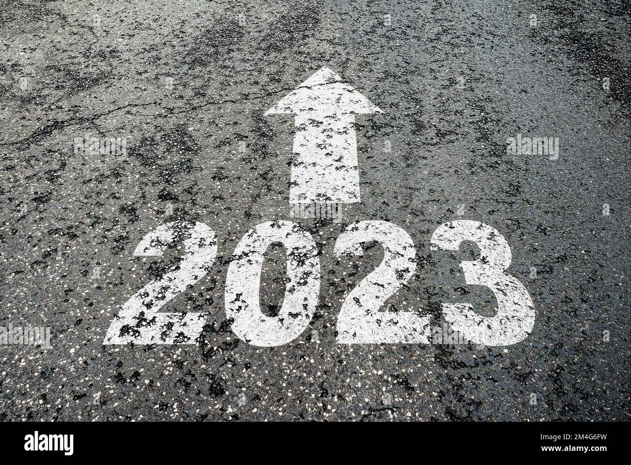 number 2023 and arrow pointing ahear on cracked asphalt, new year ...