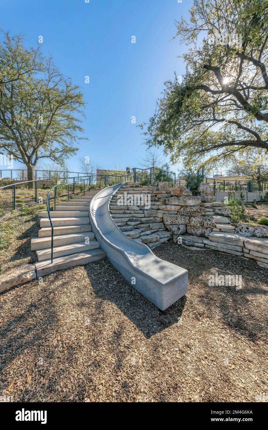 Slide and outdoor staiway on a sunny day at Waterloo park in Austin ...