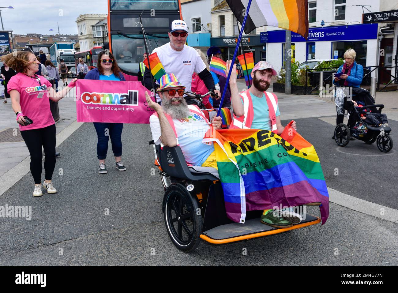Participants riding in a Chat Van Raam Electric rickshaw in the vibrant colourful Cornwall ...