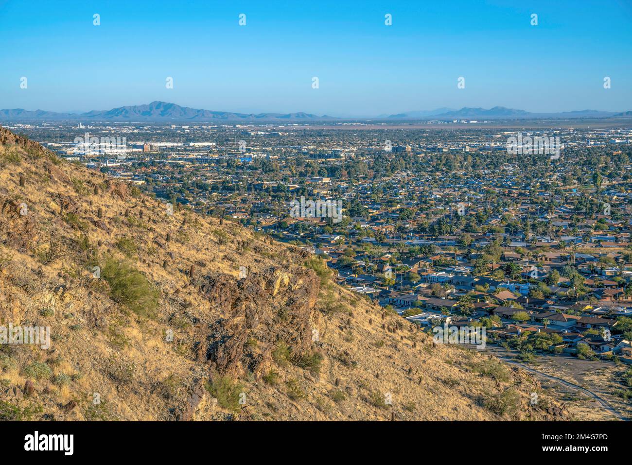 Phoenix, Arizona- Mountain slope at Pima Canyon against the view of ...