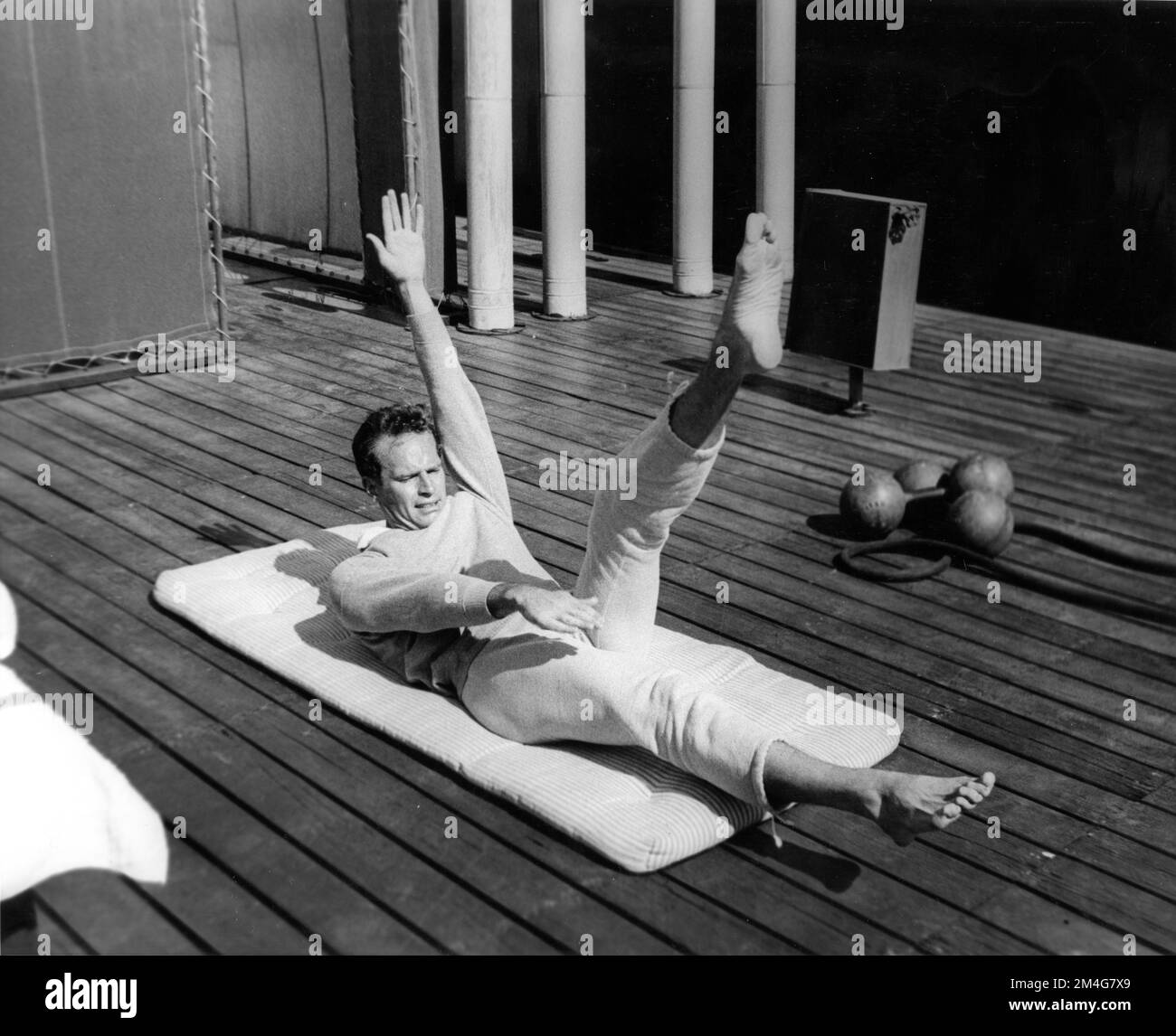 CHARLTON HESTON circa 1956 exercising at Paramount Studios in Hollywood ...