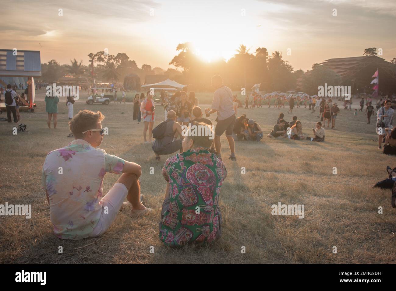 Pattaya, Thailand- December 19, 2022: People sitting on festival field ...