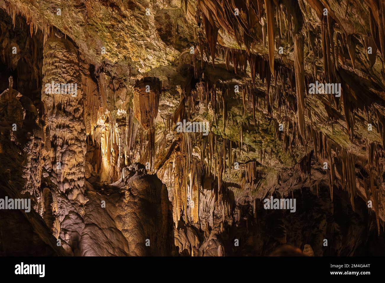 Red stalactites hanging down from the ceiling on the way into the ...