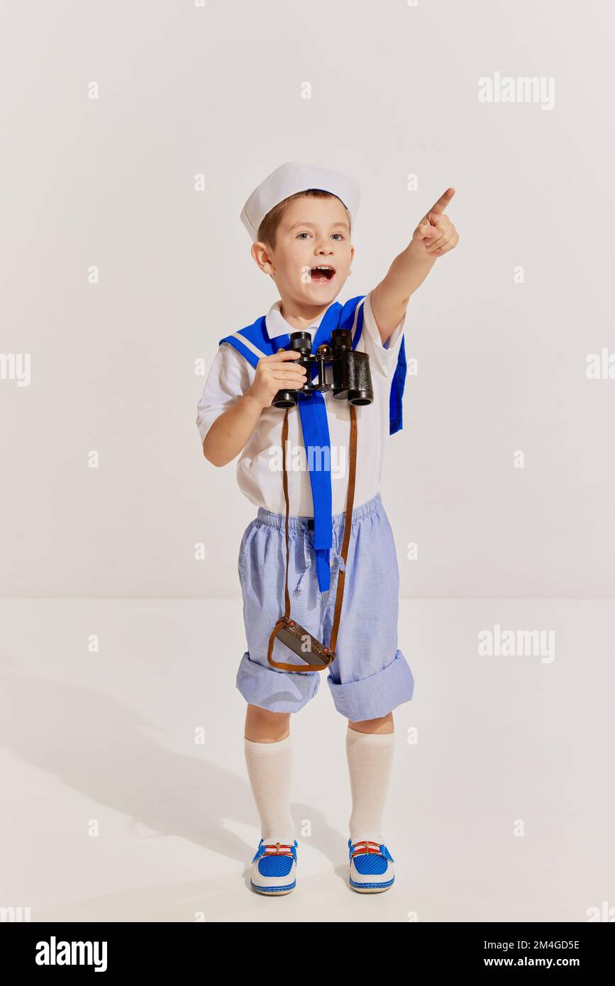 Portrait of little boy, child in image of seaman in vest posing with ...