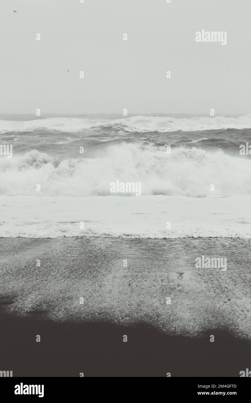 Foamy waves at seaside monochrome landscape photo Stock Photo - Alamy