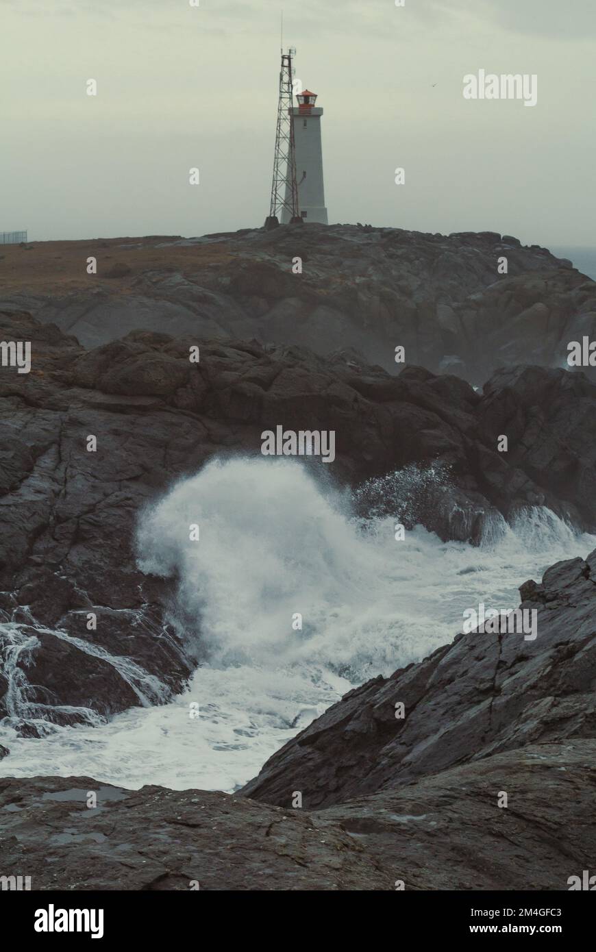 Stokksnes lighthouse on cliff at storm landscape photo Stock Photo - Alamy