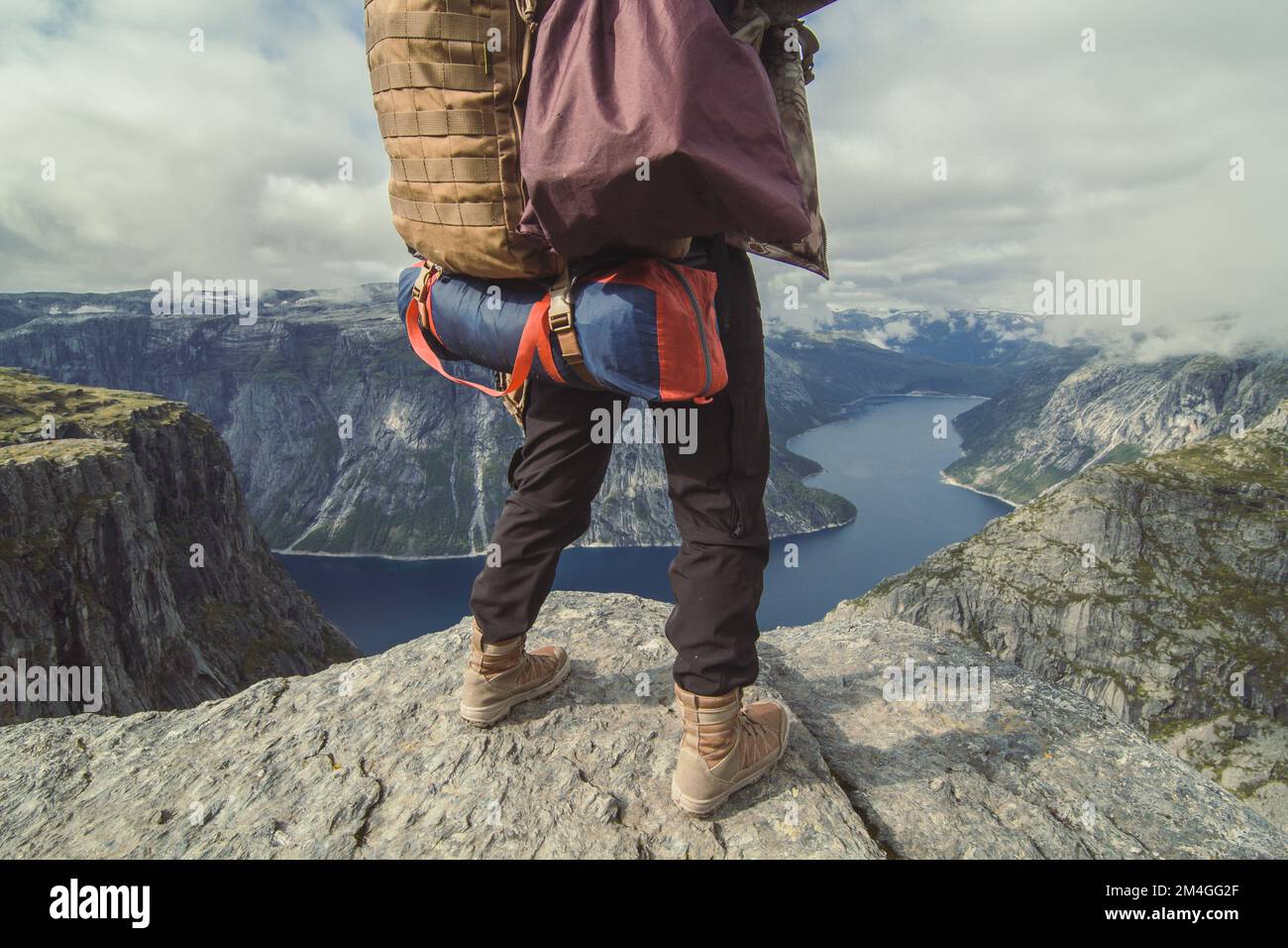 Hiker with belongings on rock over river scenic photography Stock Photo ...