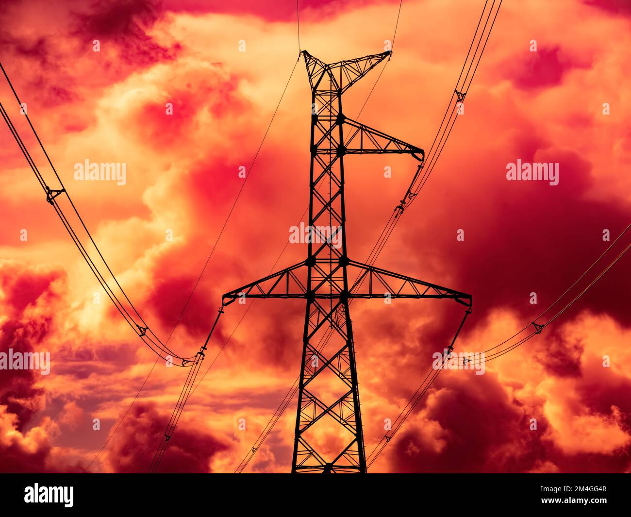 High voltage power line towers against Red cloudy apocalyptic sky Stock ...
