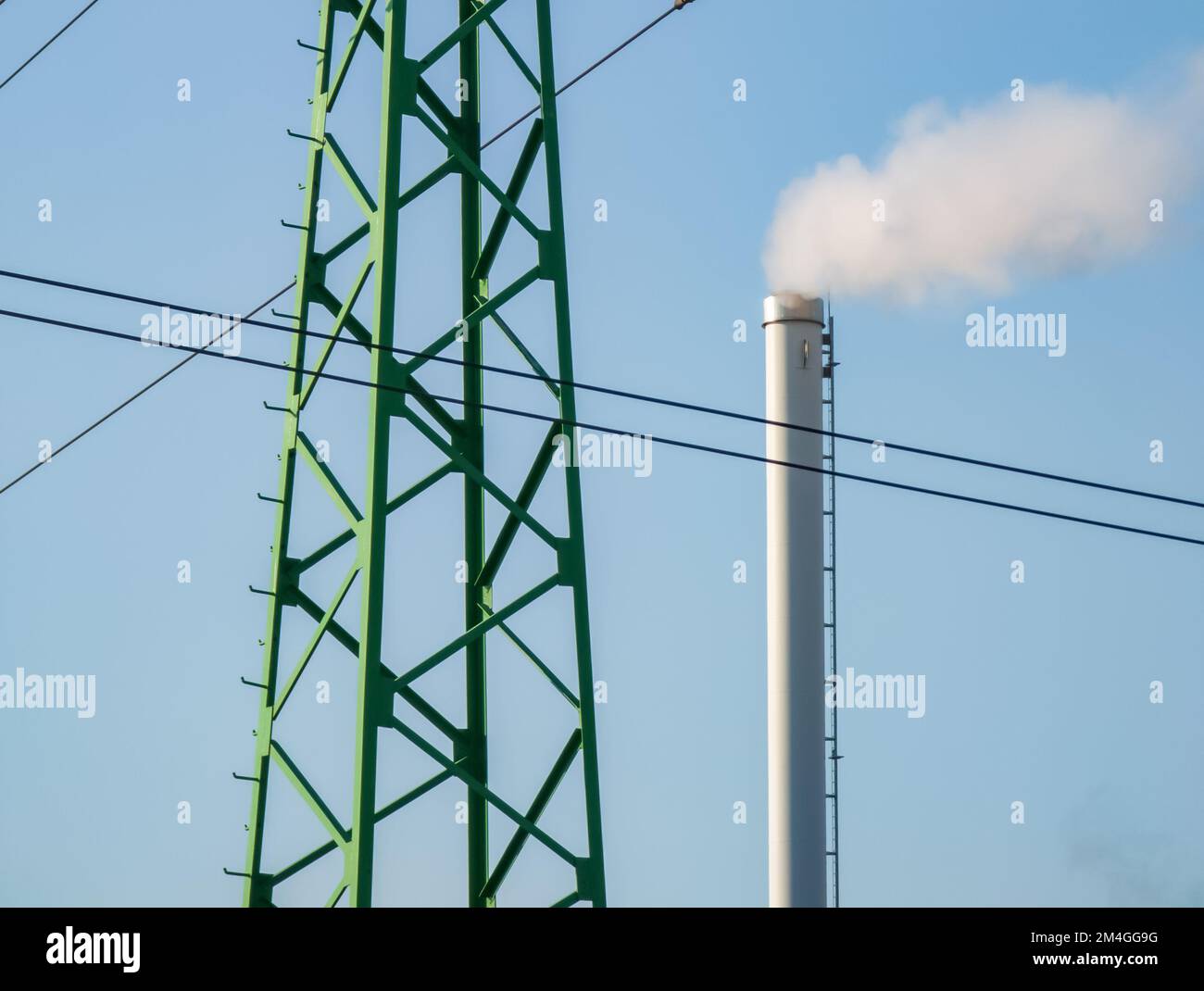 Factory chimney with smoke. Industrial pipe. Power line tower Stock ...