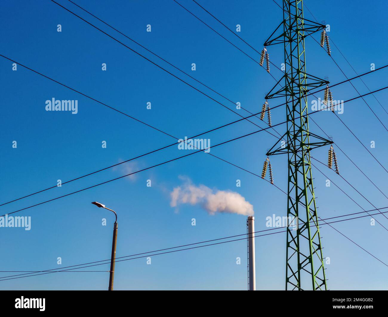 Factory chimney with smoke. Industrial pipe. Power line tower Stock ...