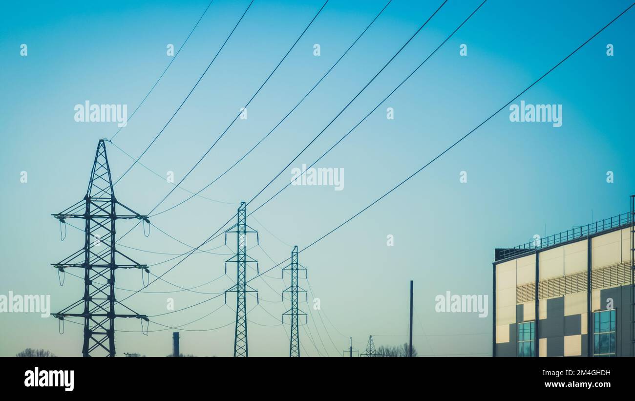 High voltage electricity power line towers against the sky Stock Photo ...