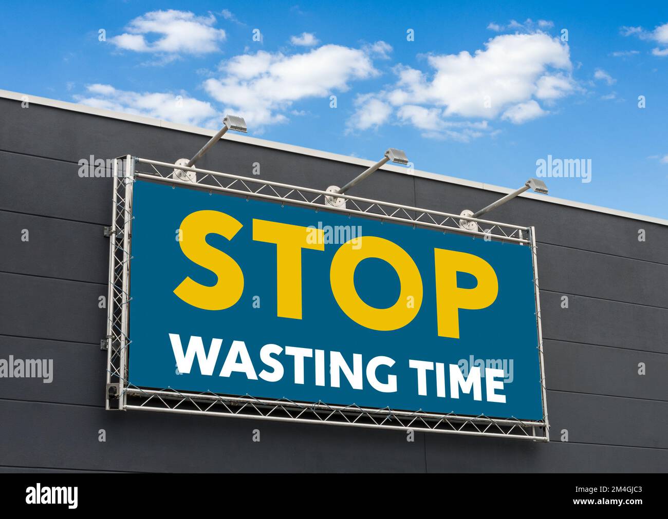 Stop wasting time written on a billboard Stock Photo - Alamy