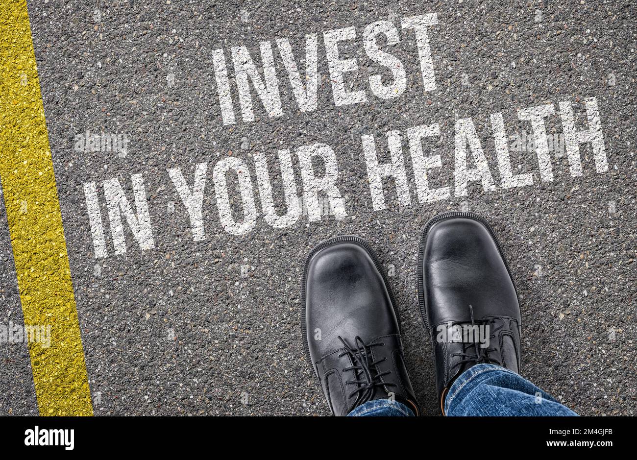Text on the road - Invest in your health Stock Photo - Alamy